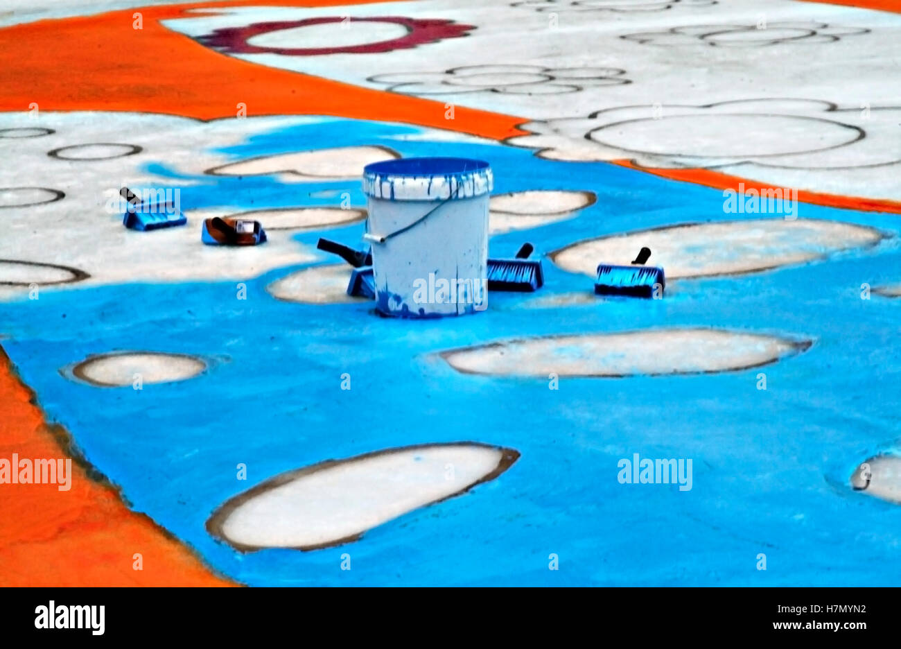 large drawing of on the pavement a paintbrush Stock Photo - Alamy
