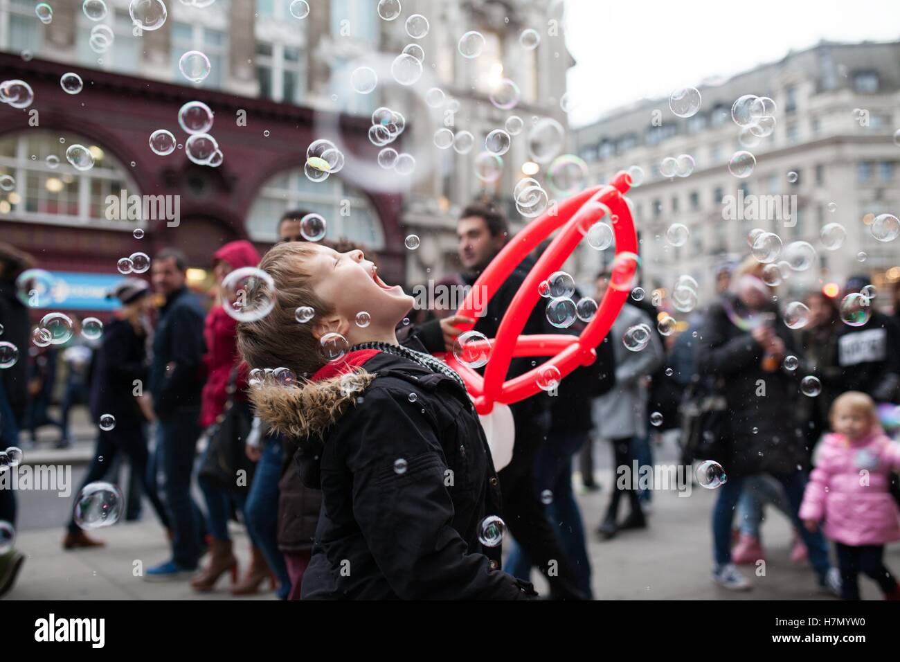 EDITORIAL USE ONLY Max Chester, 7, eats edible bubbles as families come ...