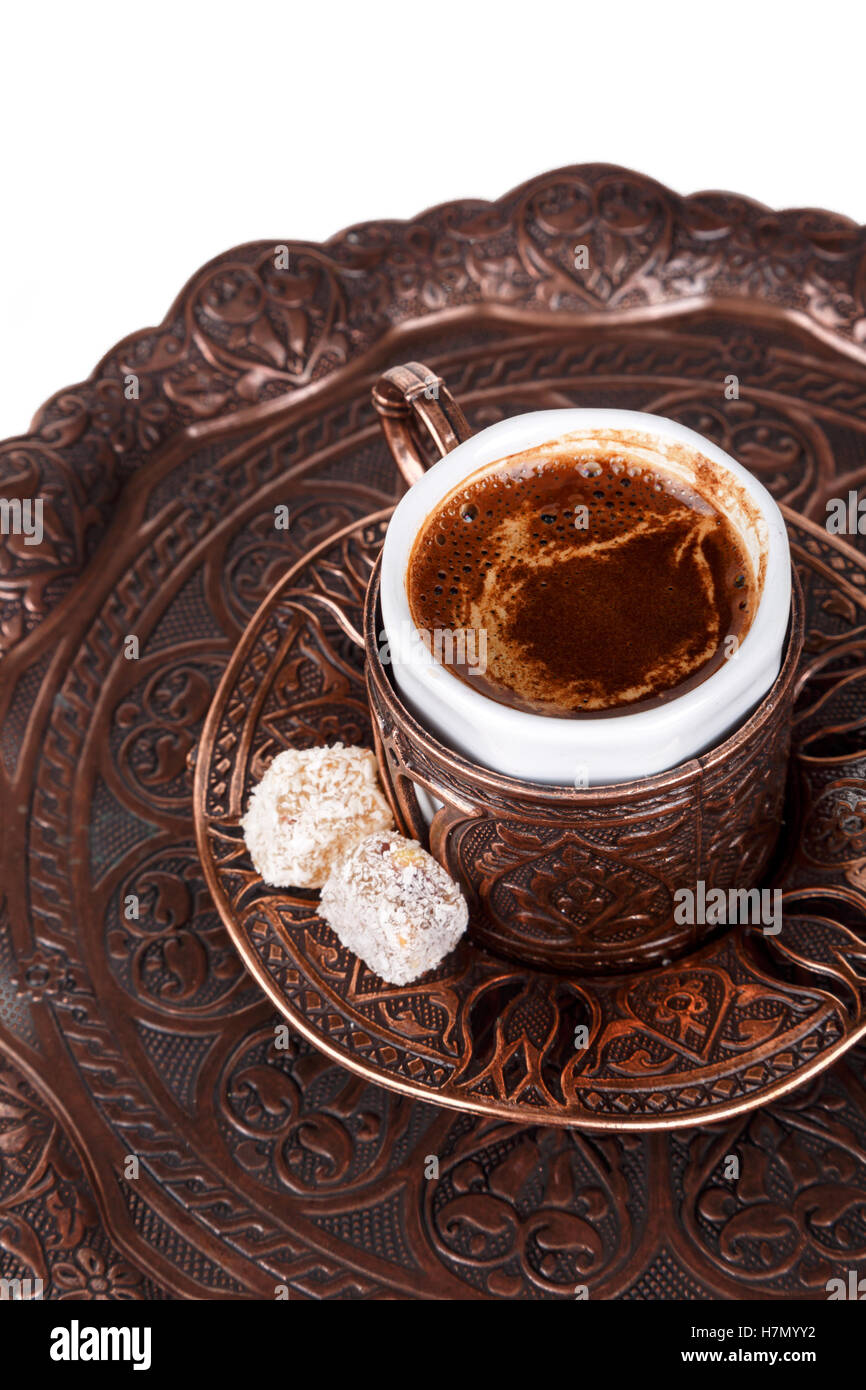 Traditional cup of Turkish coffee with foam and Turkish delights ...