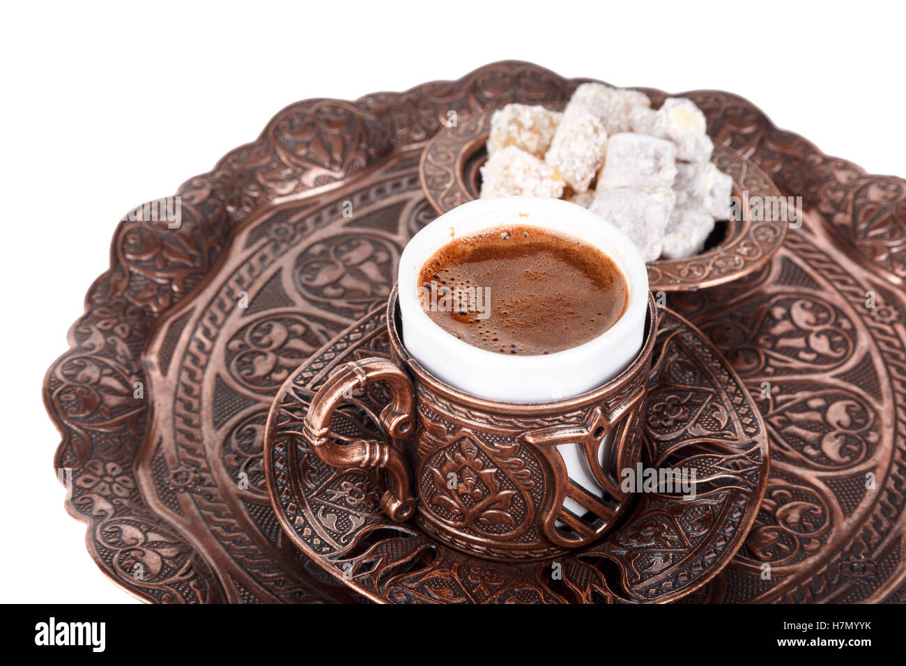 Traditional cup of Turkish coffee with foam and Turkish delights ...