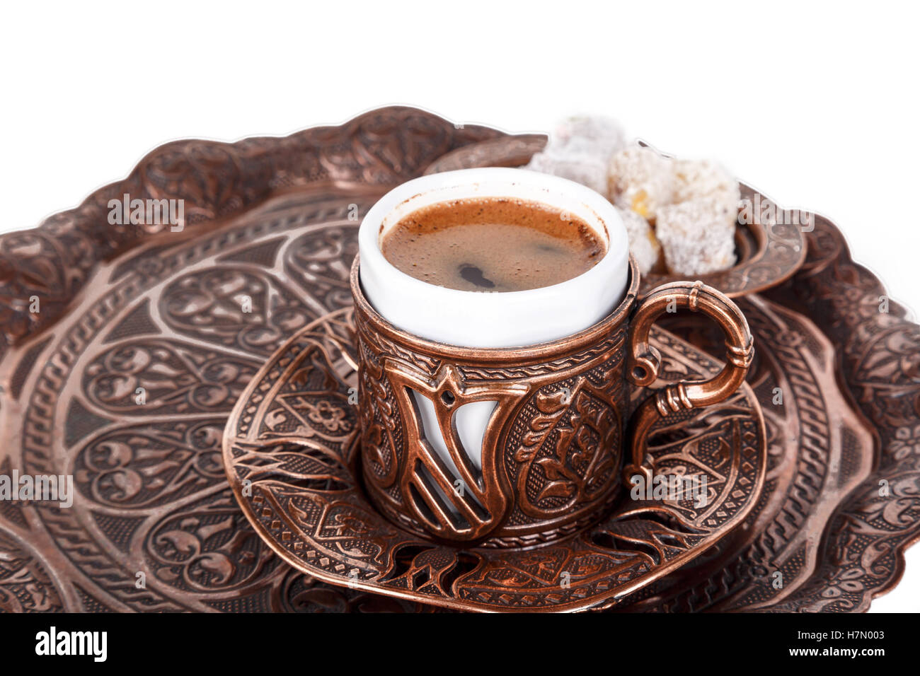 Traditional cup of Turkish coffee with foam and Turkish delights ...