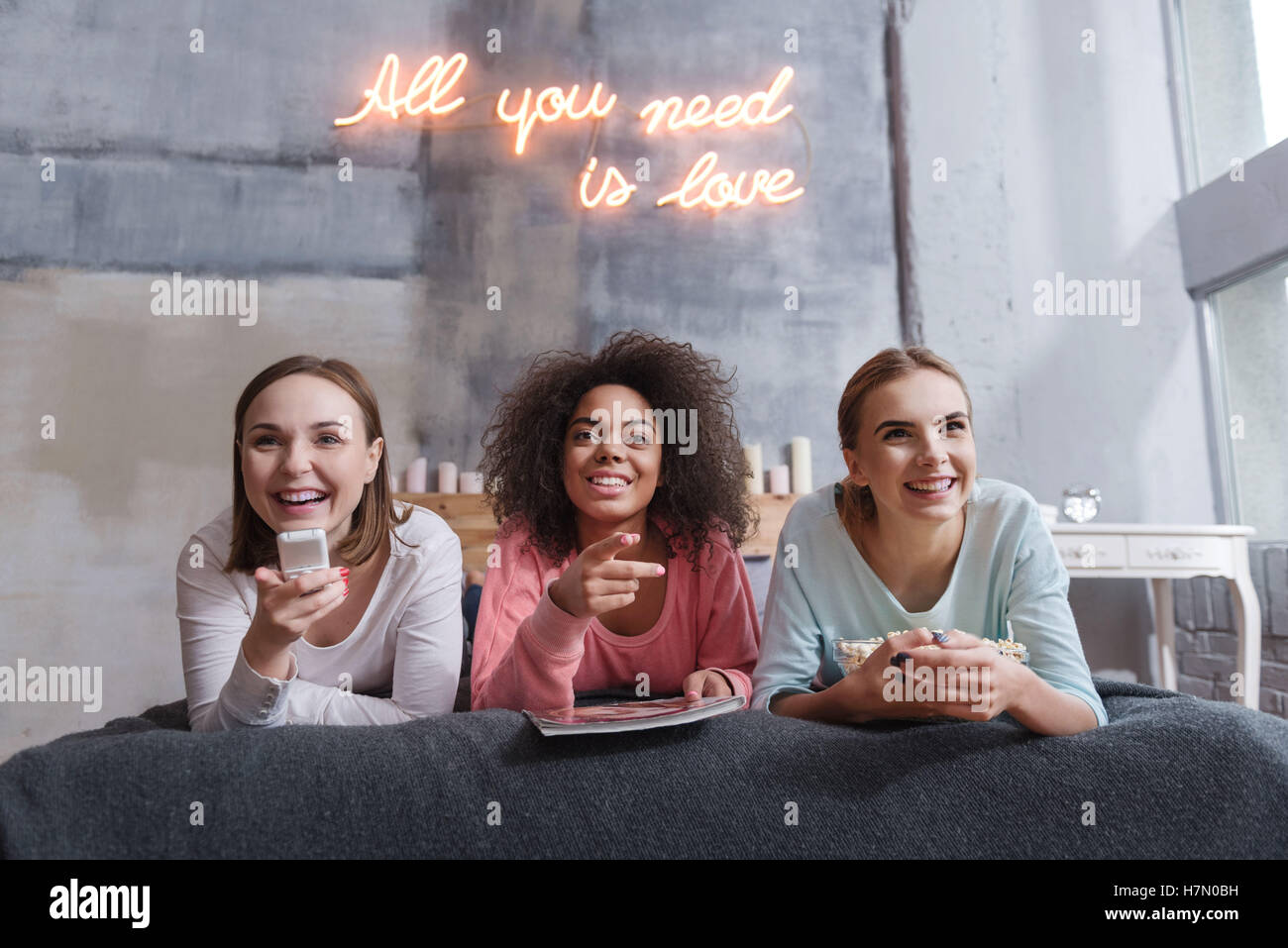 Laughing girls having fun at home Stock Photo - Alamy