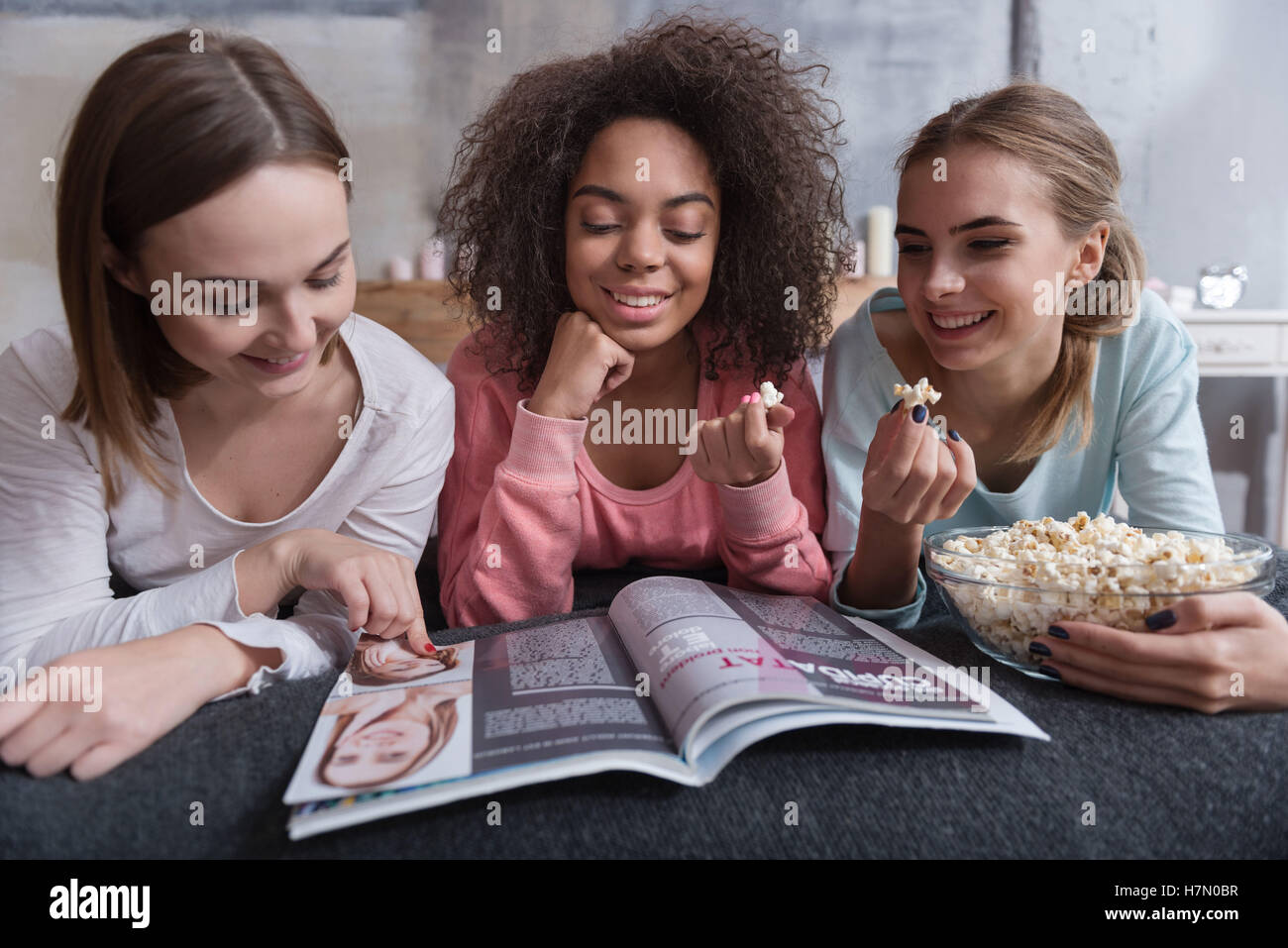 Smiling friends resting together Stock Photo - Alamy