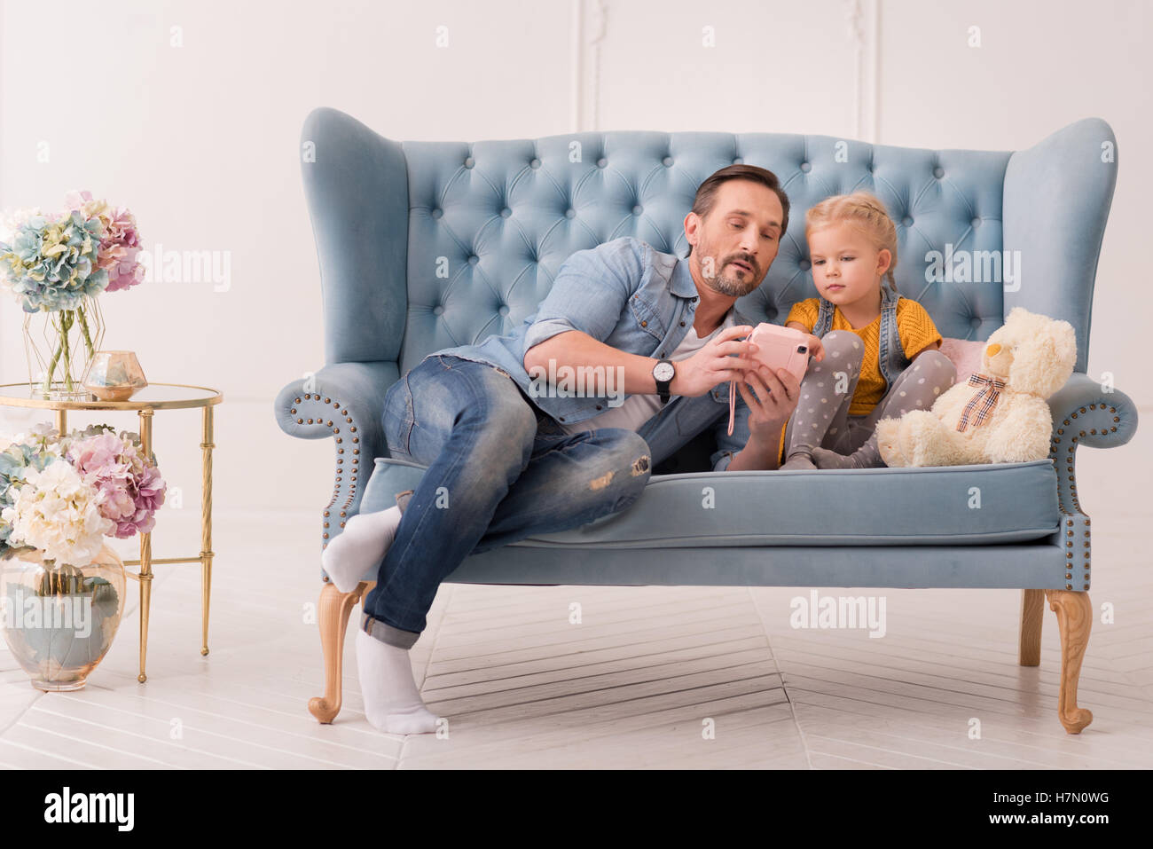 Good looking caring father playing with his daughter Stock Photo - Alamy