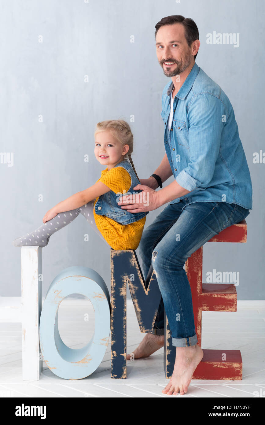 Handsome caring father holding his daughter Stock Photo - Alamy Handsome caring father holding his daughter Stock Photo - Alamy