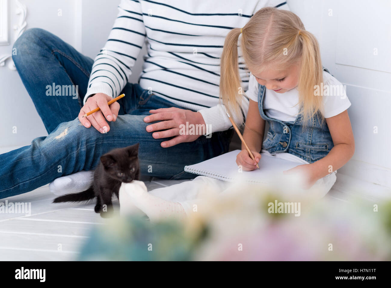 Hard working diligent girl drawing a picture Stock Photo - Alamy