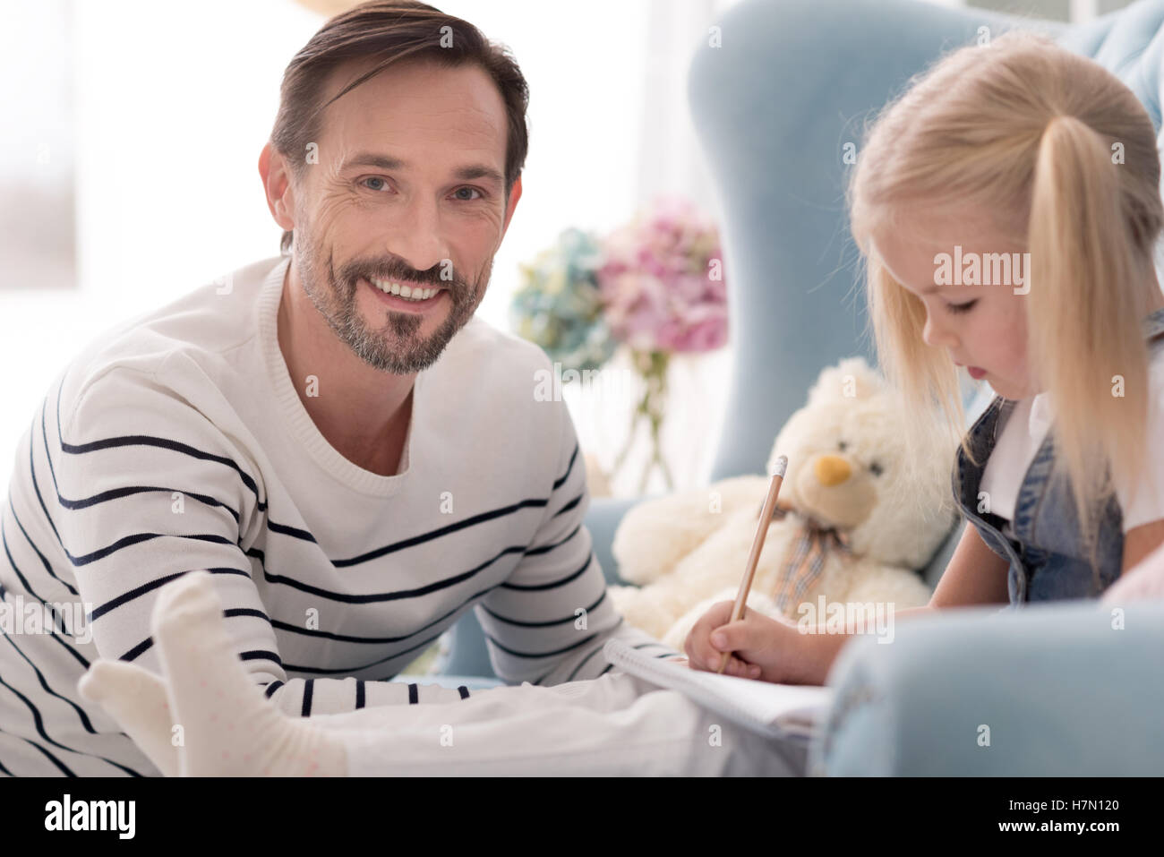 Positive cheerful man looking at you Stock Photo - Alamy