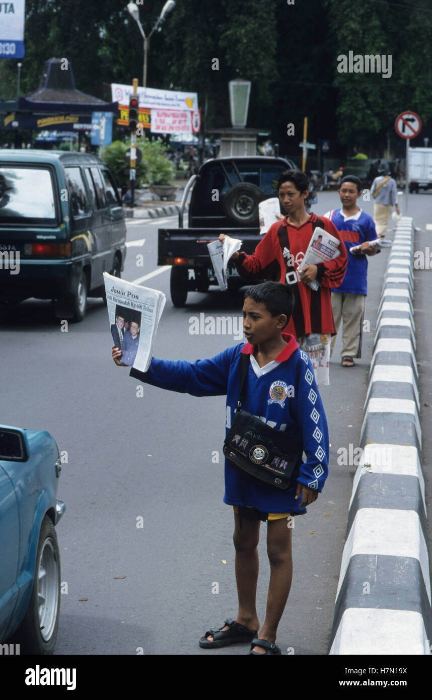 INDONESIA, Java,Jakarta, children sell newspapers Stock Photo - Alamy