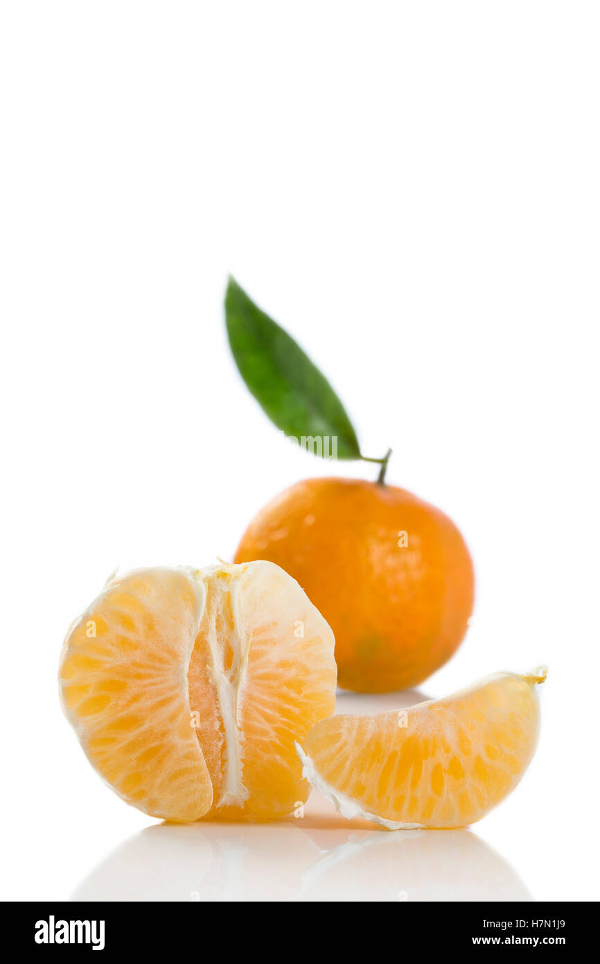 Ripe mandarin with leaves close-up on a white background Stock Photo ...