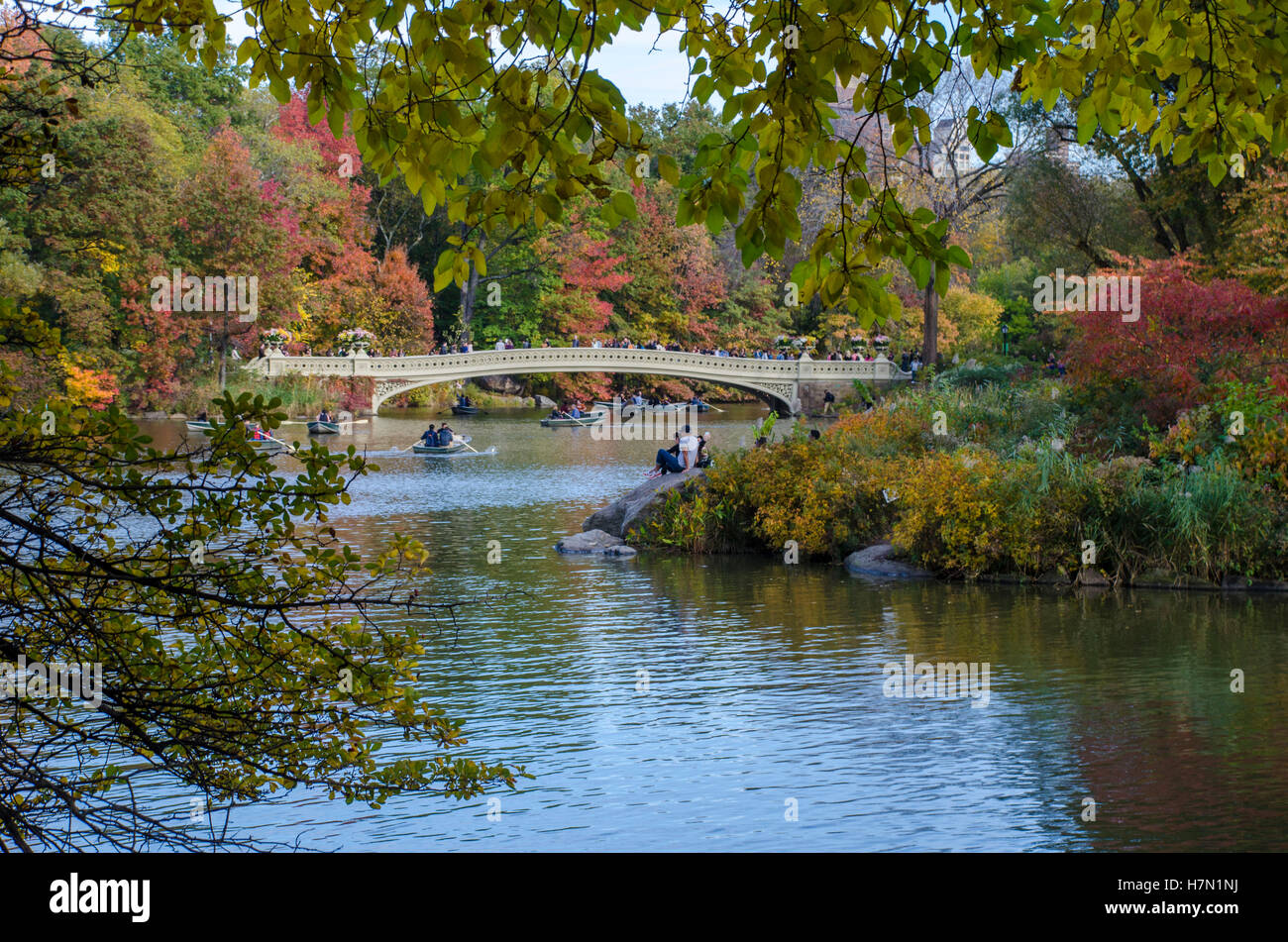 Bridge over water with fall trees all around Stock Photo - Alamy