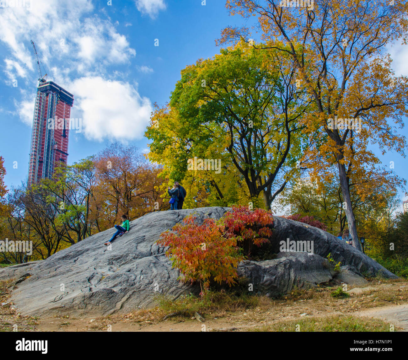 Big rock with fall colored trees Stock Photo - Alamy