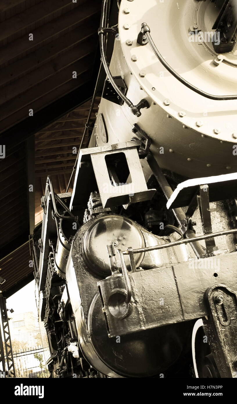 close up of historical steam locomotive engine parked in an old railway ...