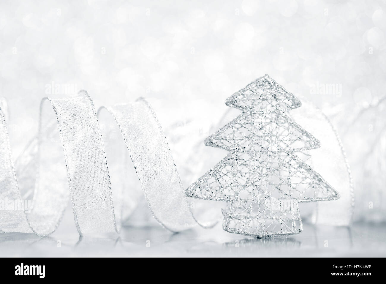 Toy silver decorative Christmas tree on glitter background Stock Photo ...