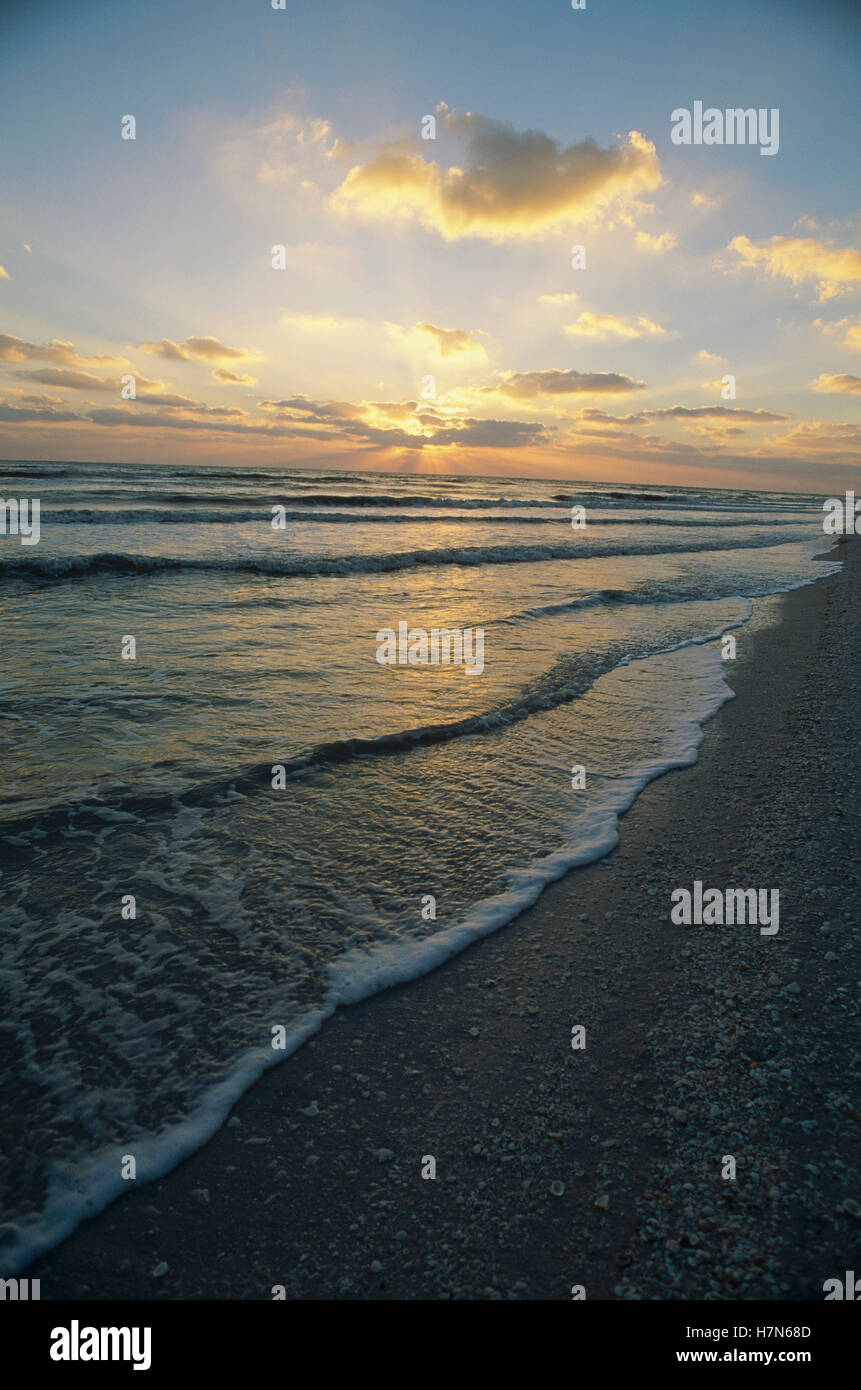 Sunset over shell covered beach, Sanibel Island, Florida Stock Photo ...