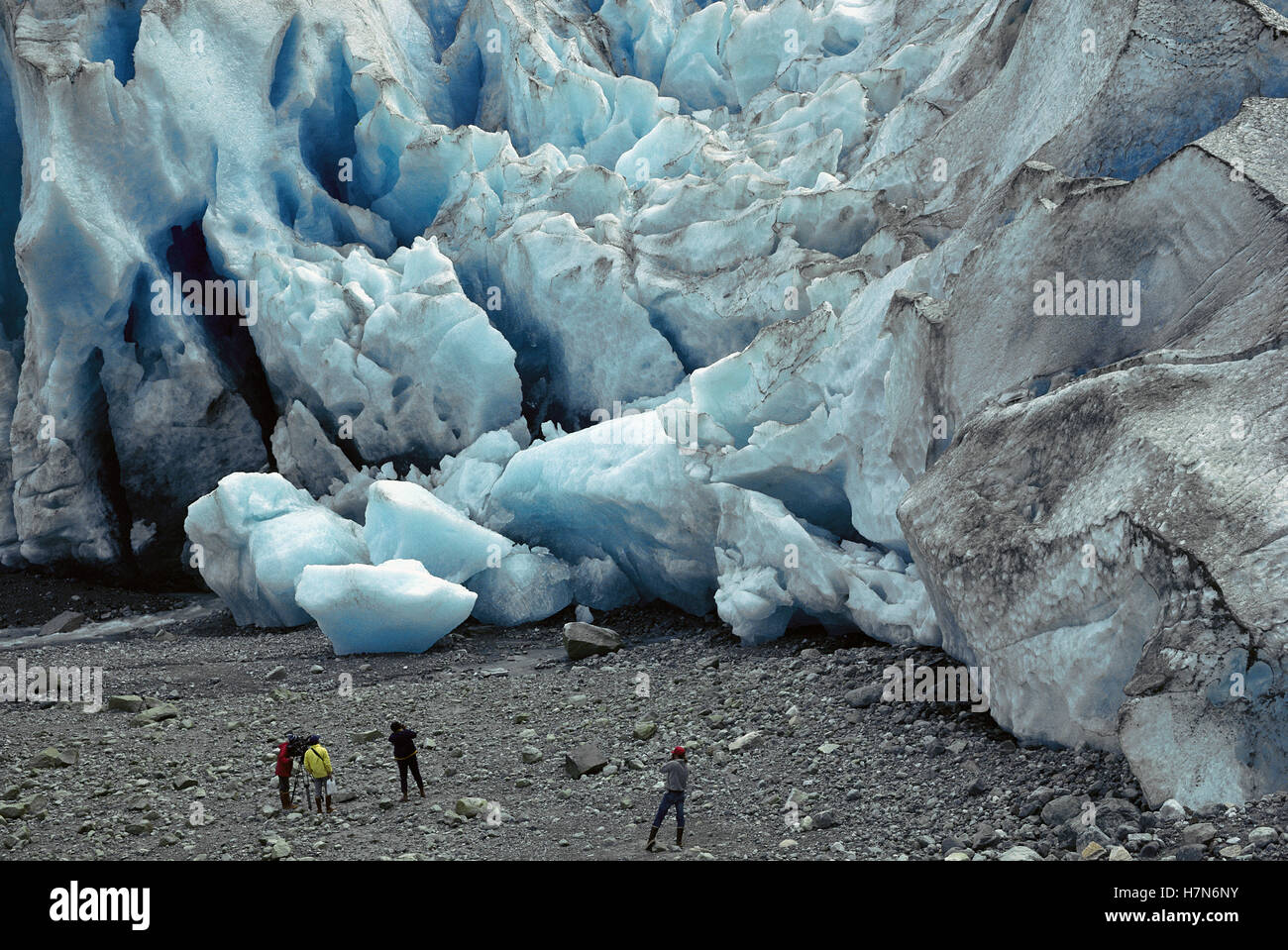 Tourists in front of glacier, Glacier Bay National Park and Preserve ...