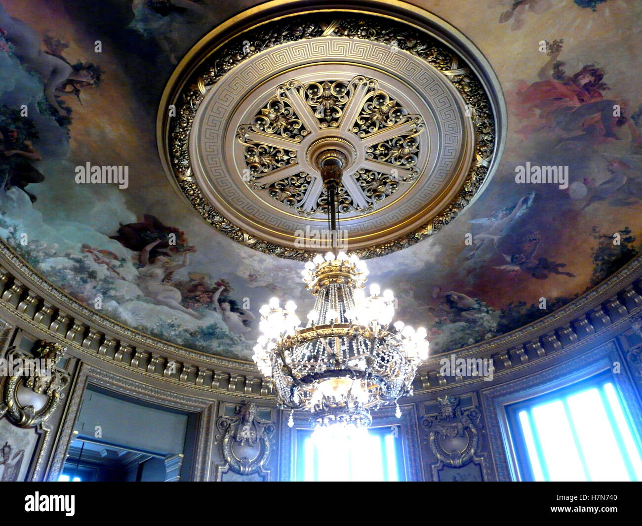 Opera house ceiling detail. Chandelier and mural, stucco decoration in ...
