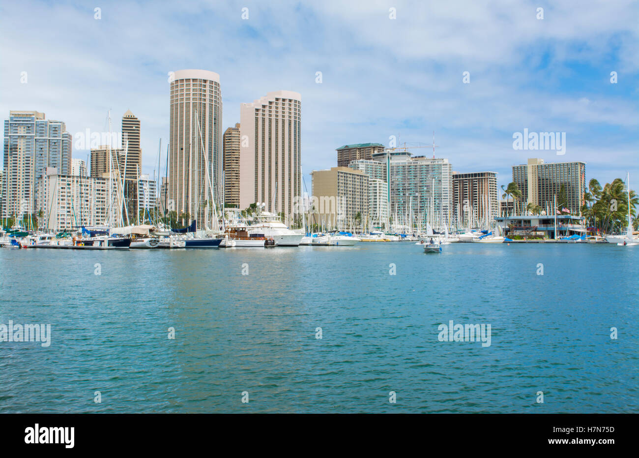 Honolulu Hawaii Oahu skyline from boat marina with sailboats school on ...