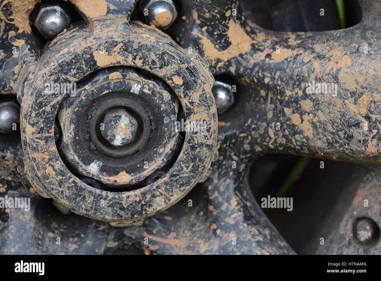 Color detail shot of an off-road car's wheel, covered in mud Stock ...