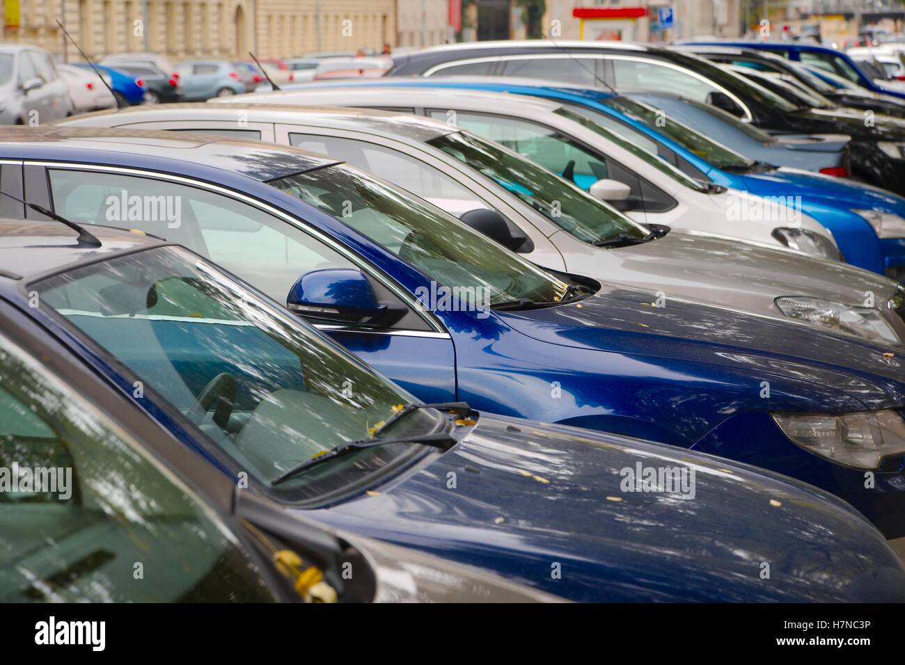 Cars parked in a row Stock Photo - Alamy