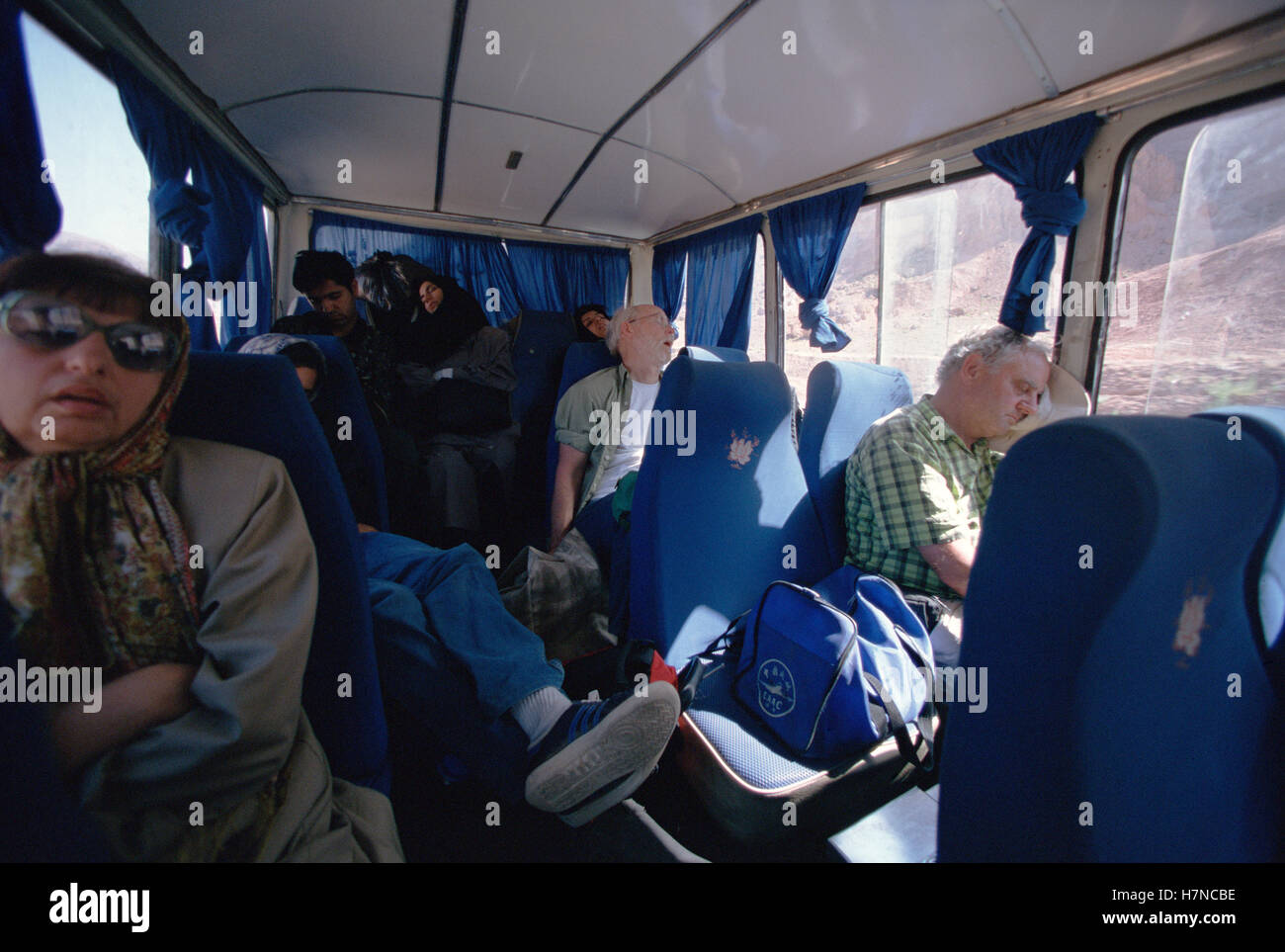 Busload of biologists sleeping after a long day of hunting in desert ...