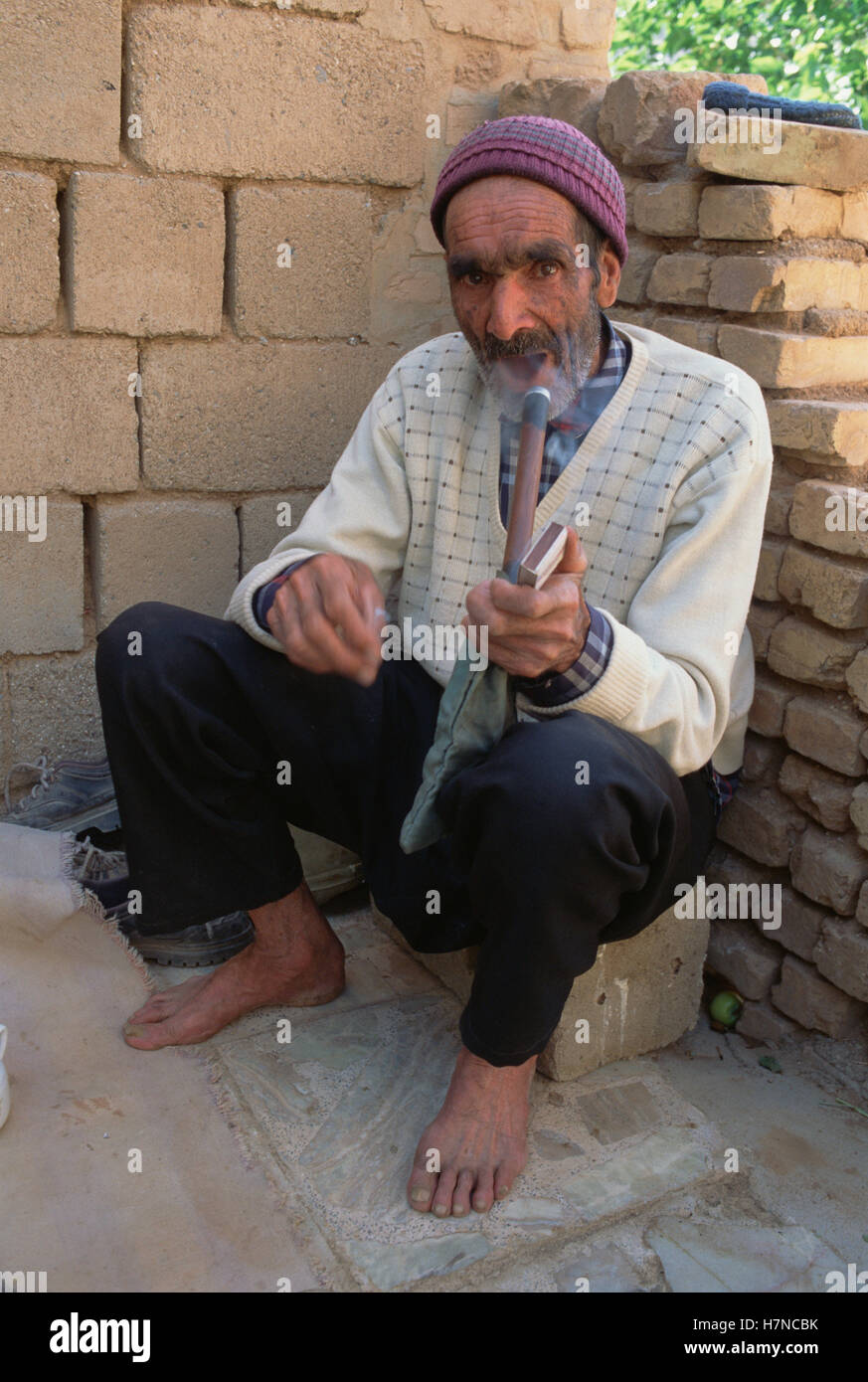 Man smoking a pipe, Deh Bala, Iran Stock Photo - Alamy