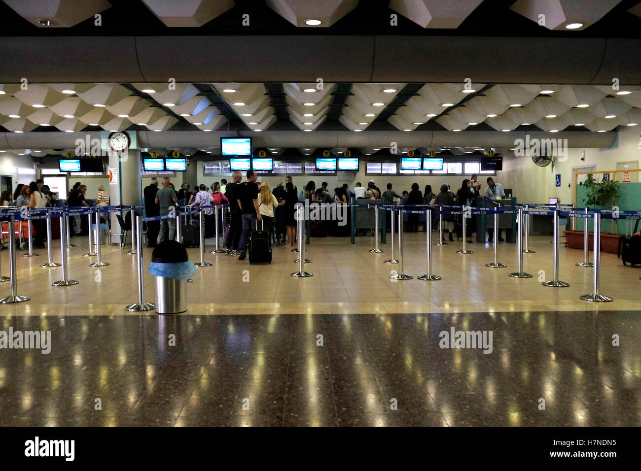 Passengers queue at the Passport Control hall of Haifa seaport in ...