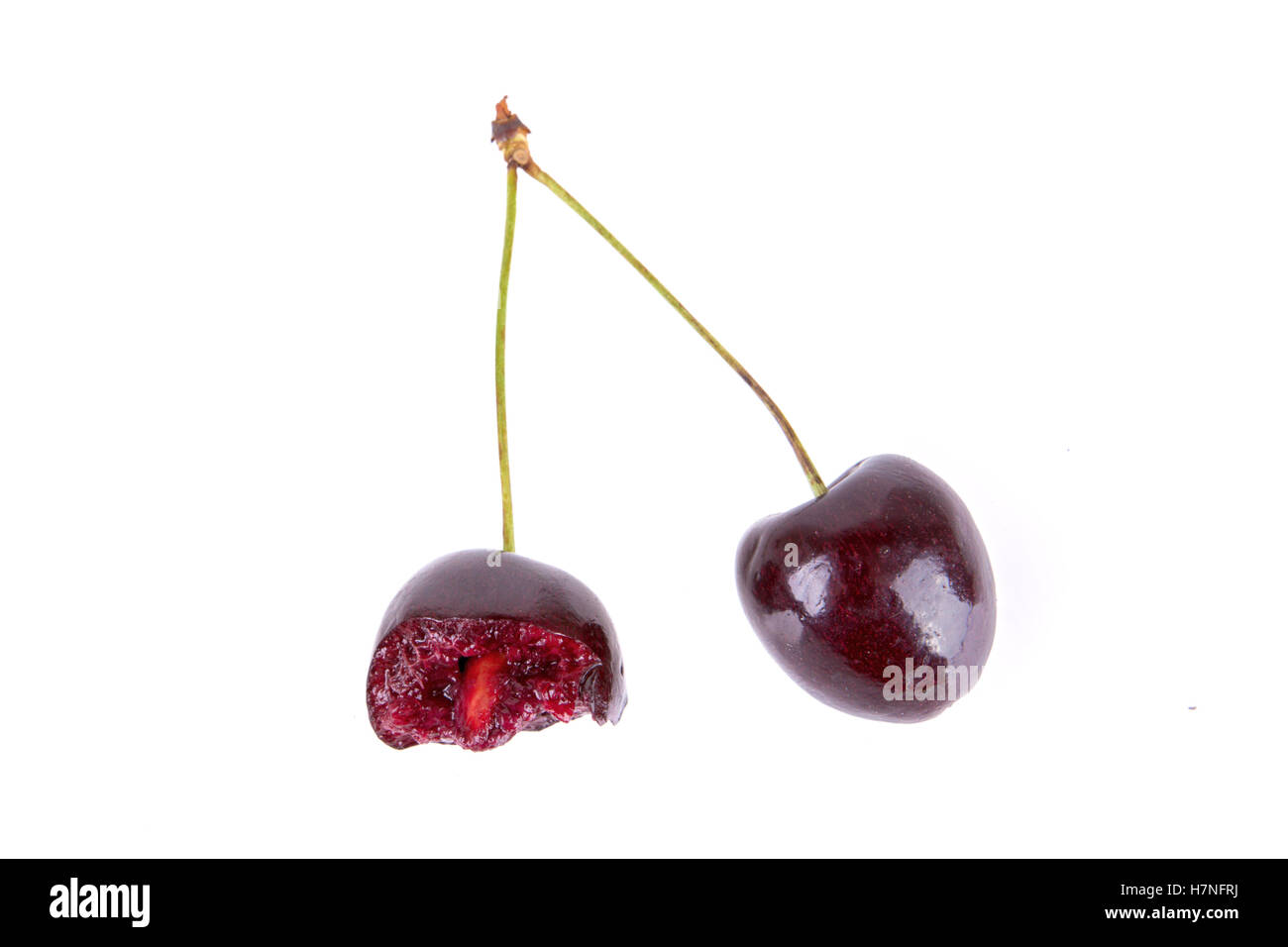 Dark red cherry isolated on a white background Stock Photo - Alamy