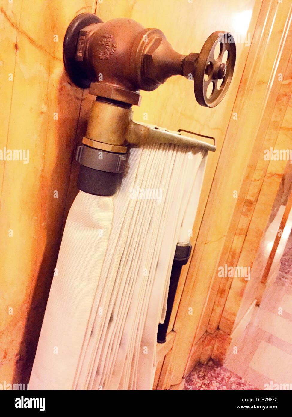 Firehose and standpipe firefighting equipment in hallway Stock Photo ...