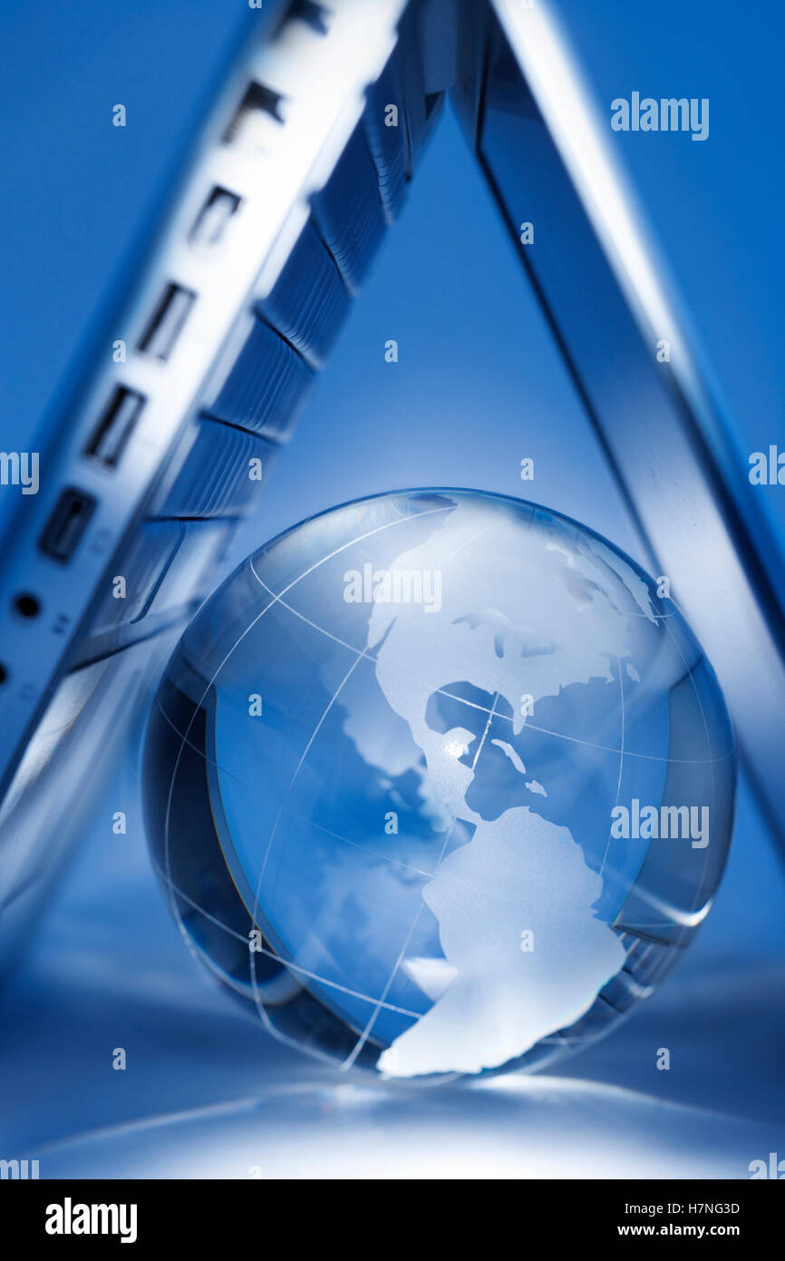 glass globe and laptop Stock Photo - Alamy