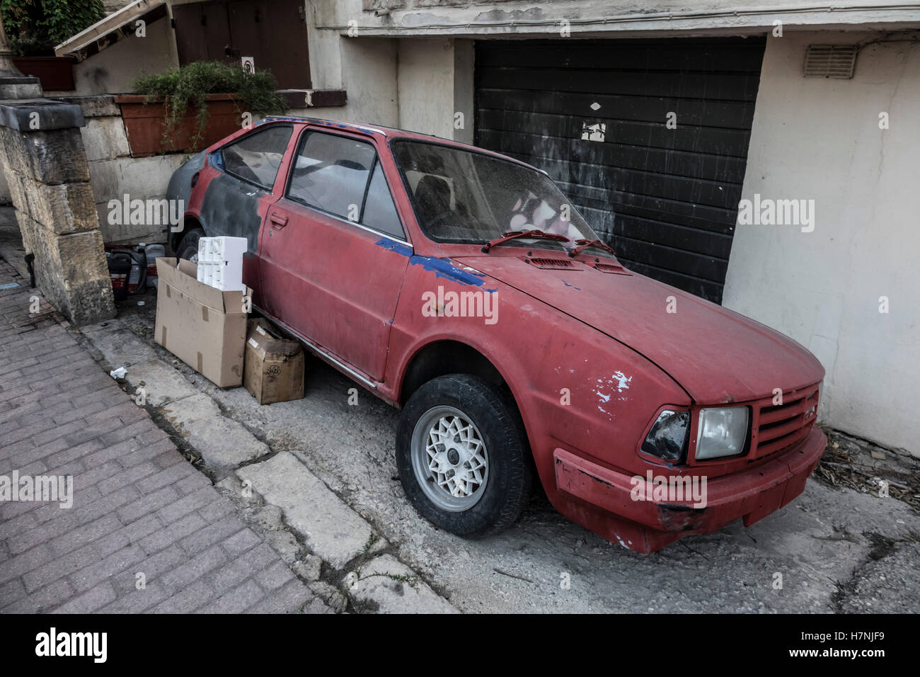 Old car in Qawra Malta Stock Photo - Alamy