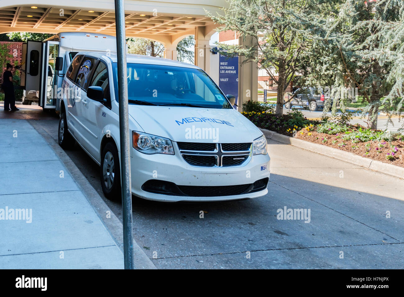 A Medride wheelchair van and personel waiting for a patient outside of ...