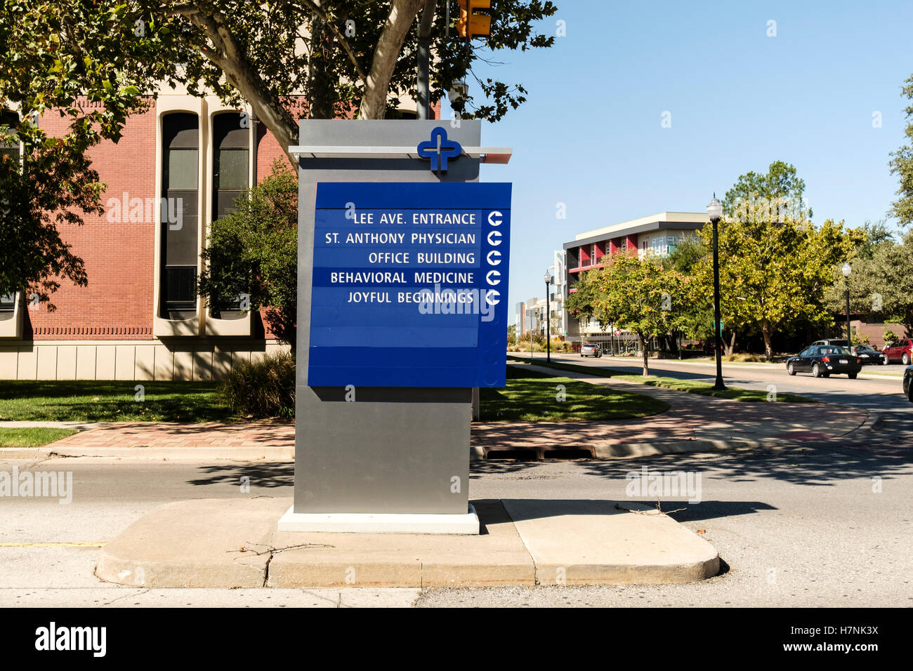 A monument sign of St. Anthony's hospital pointing arrows to direct, in ...