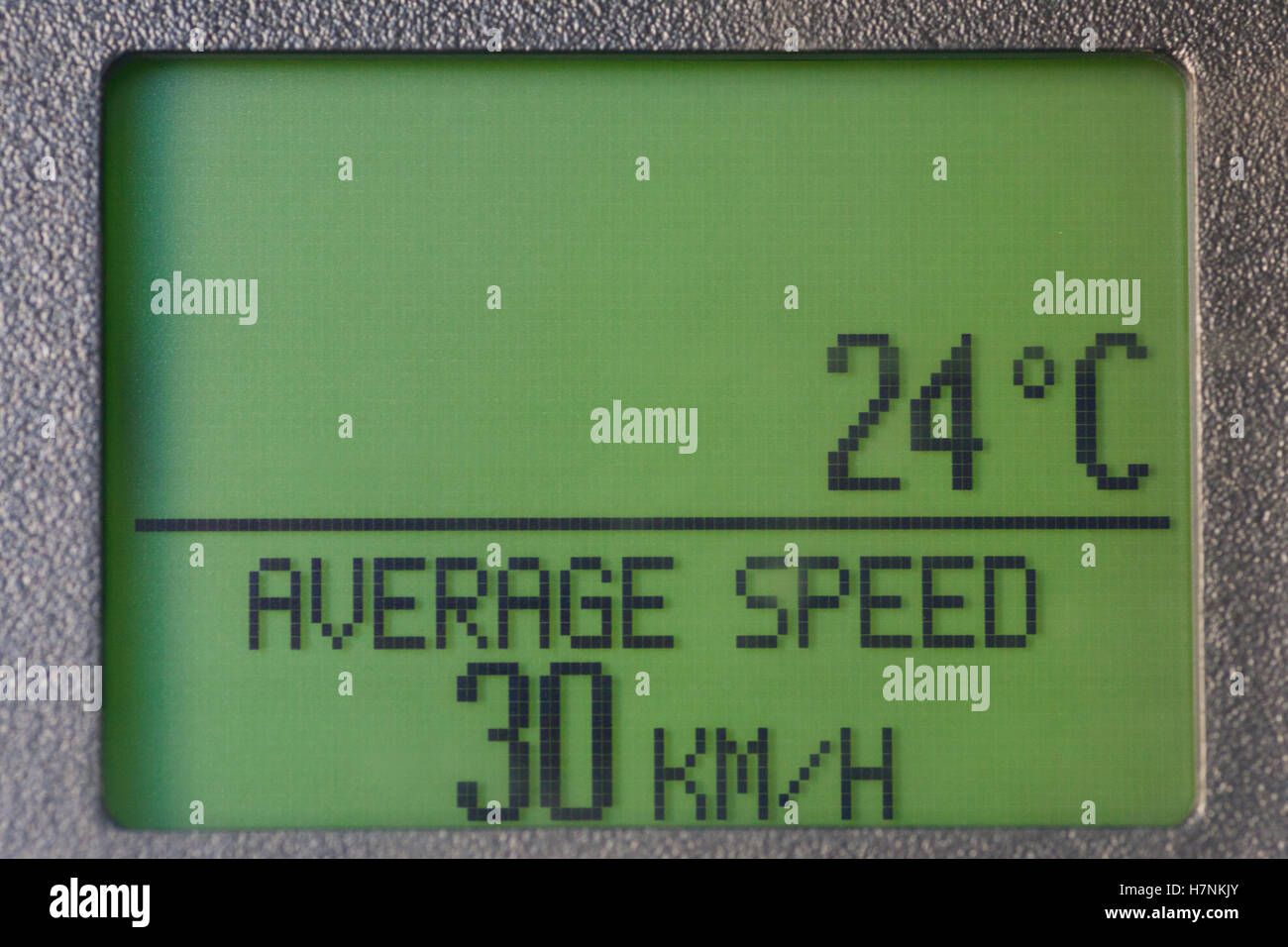 Color close up of a car's dashboard showing the average speed and ...