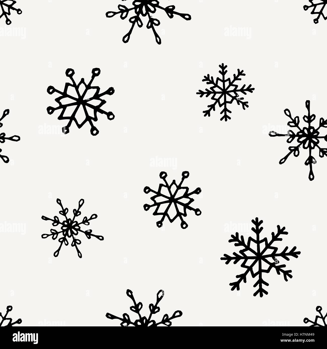 Seamless repeating pattern with hand drawn snowflakes in black and ...