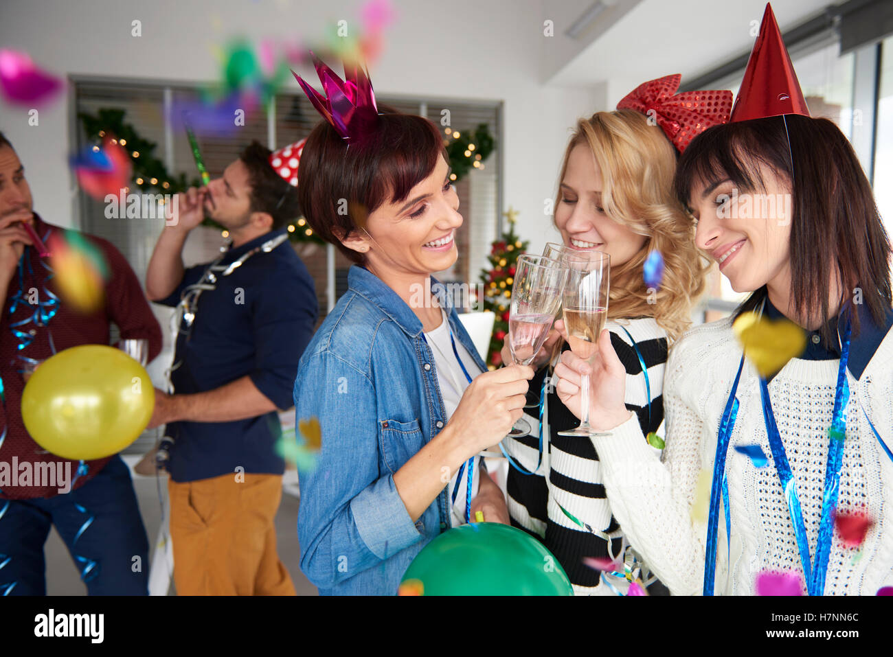 Girls making toast with a glass of champagne Stock Photo - Alamy
