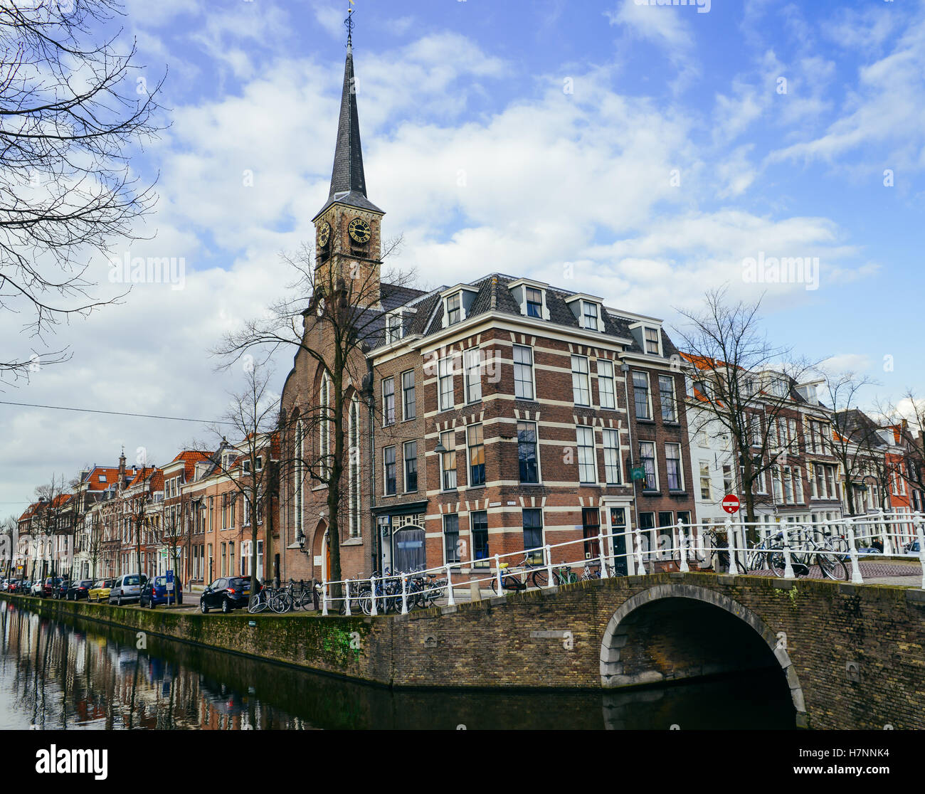 Colorful street view with traditional dutch houses, bicycles, canal in ...