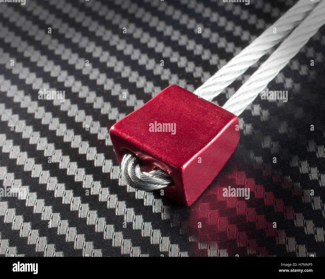 Small red nut that is used for protection when climbing Stock Photo - Alamy