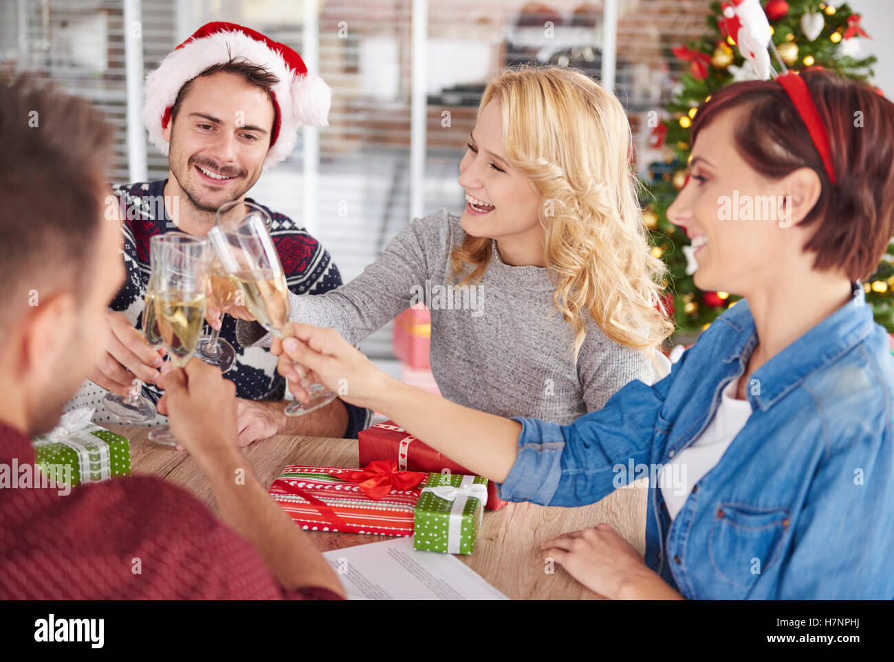Young people toasting during Christmas Party Stock Photo - Alamy
