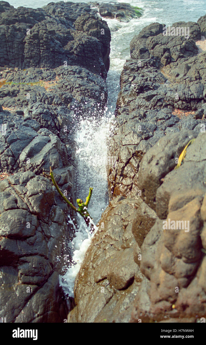A narrow gorge called 'Baman Ghal' on rocky beach of Hedvi Village ...