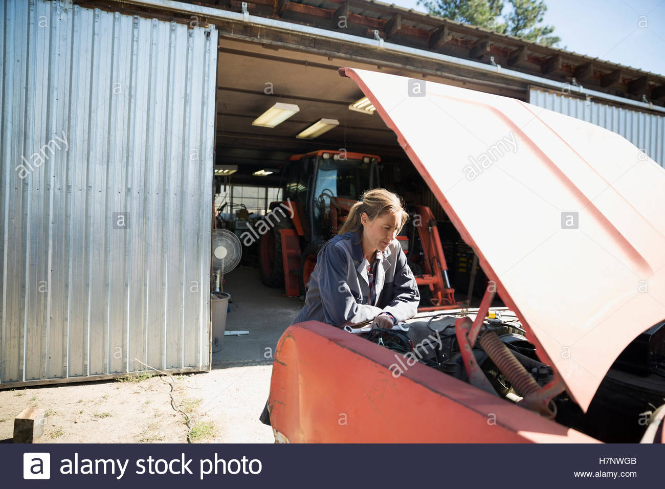 Female mechanic working on truck engine Stock Photo - Alamy