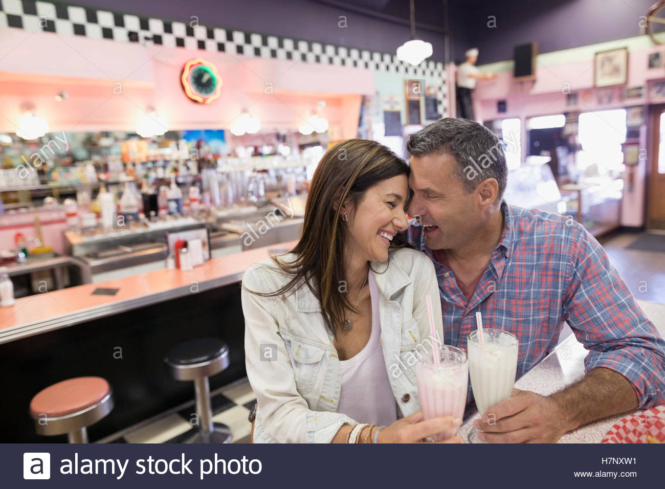 Couple sharing milkshake hi-res stock photography and images - Alamy