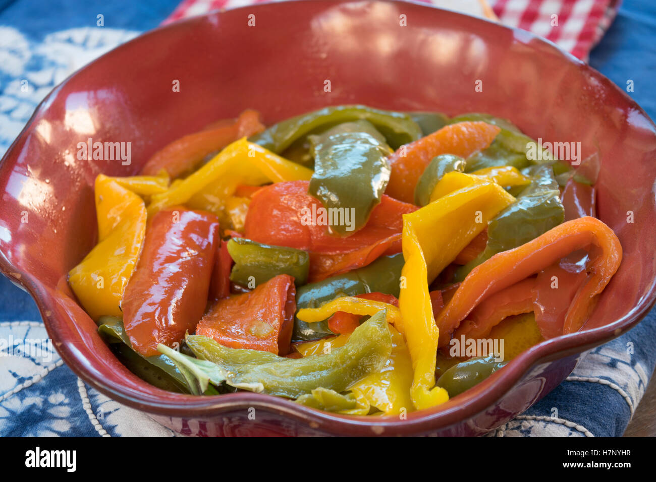 fried bell peppers of various colors cut in strips Stock Photo - Alamy