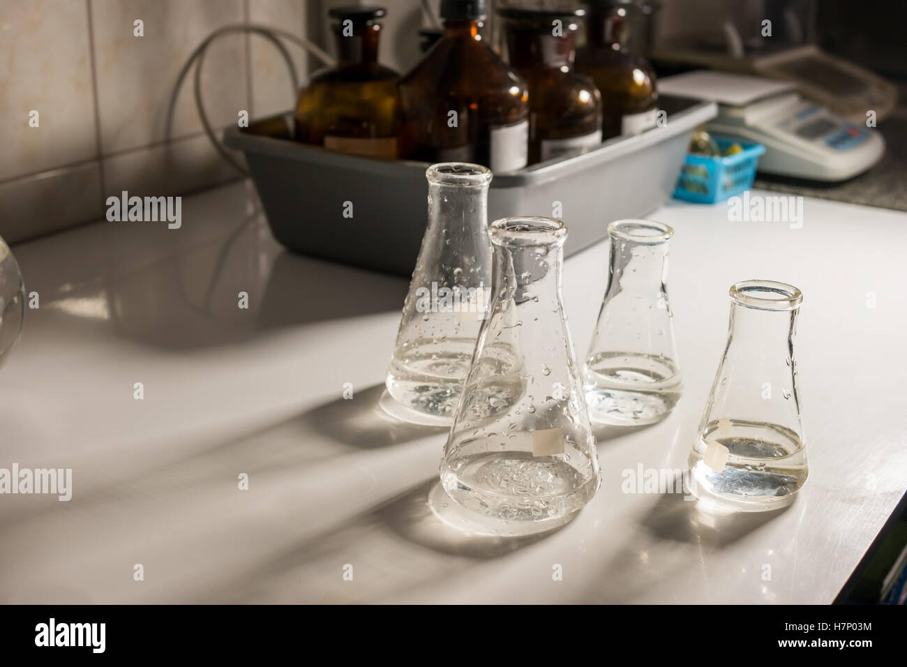 Flasks with transparent liquid Stock Photo - Alamy