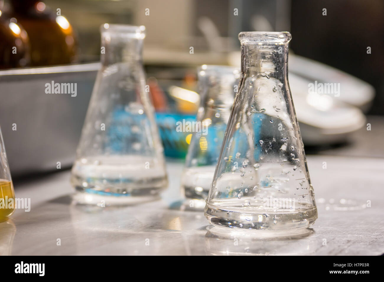 Beaker with transparent liquid Stock Photo - Alamy