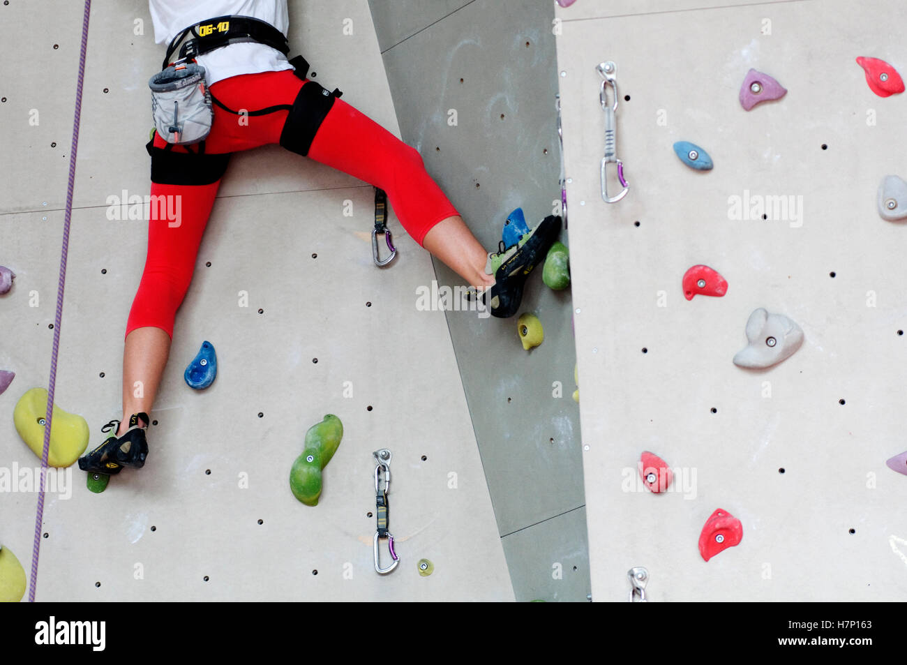 Woman Climbing with Ropes on Climbing Wall Stock Photo - Alamy
