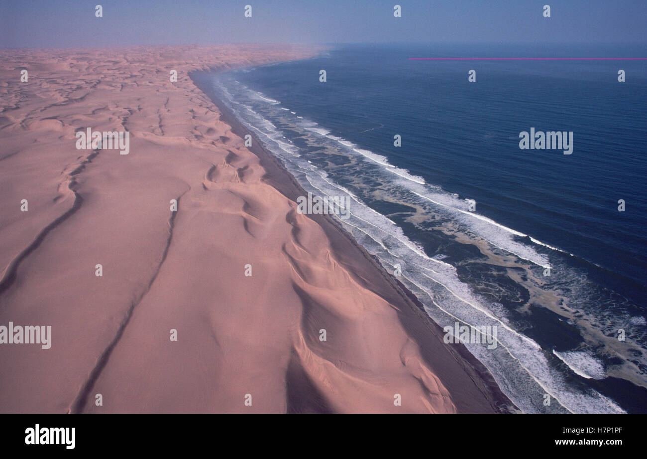Sand dunes meet Atlantic Ocean, Skeleton Coast, Namib Desert, Namibia ...