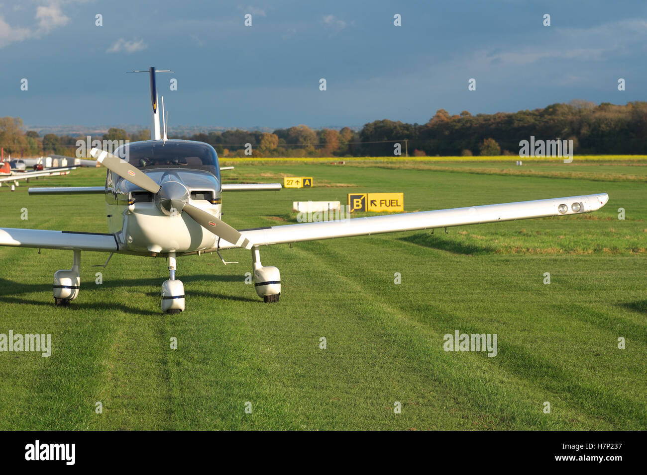 Light aircraft Socata TB-10 Tobago parked on a grass general aviation ...
