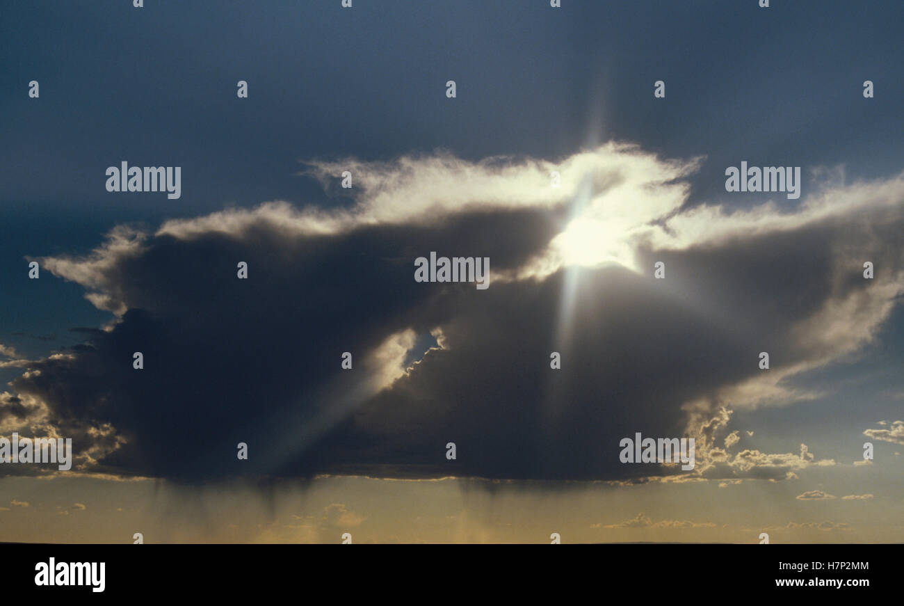 Sun shining through storm cloud, Montana Stock Photo - Alamy