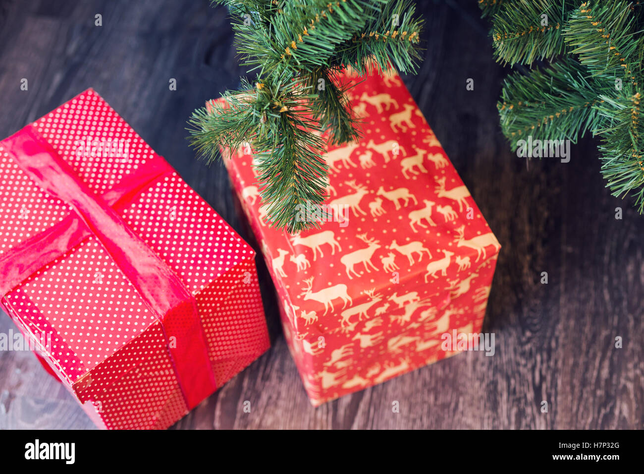 Gift boxes under a Christmas tree Stock Photo - Alamy