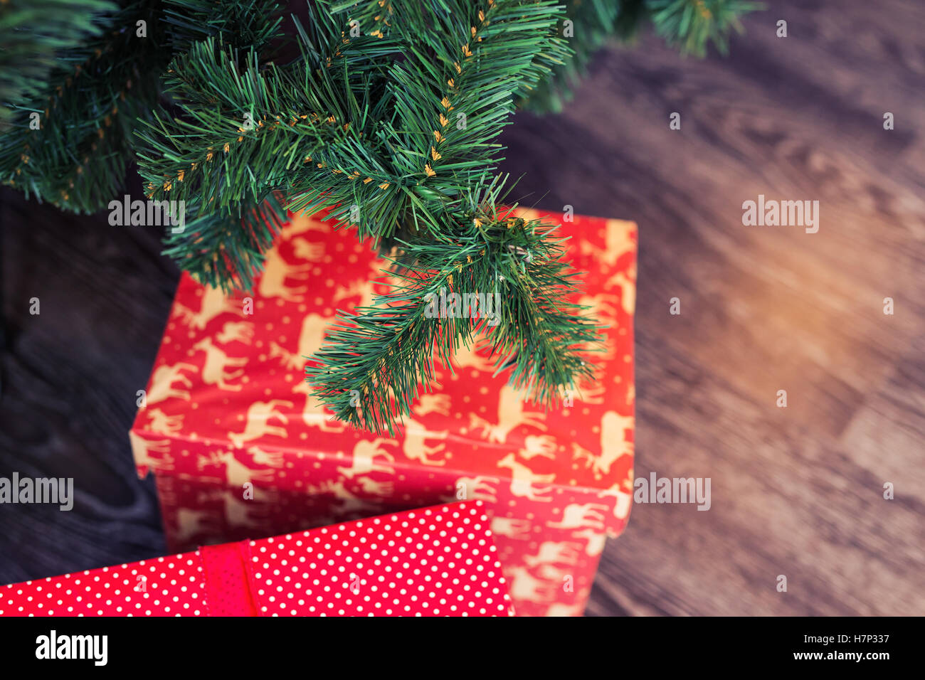 Gift boxes under a Christmas tree Stock Photo - Alamy